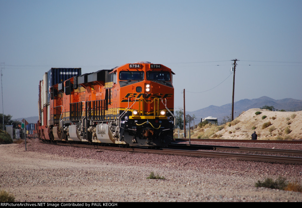 BNSF 6794 with BNSF 6793 behind her head eastward into the BNSF Barstow yard for a crew change.